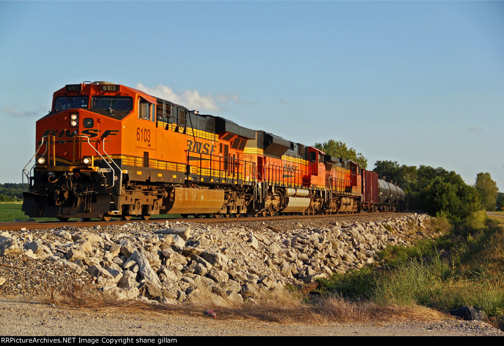 BNSF 6103 Heads into the evening sun with a empty oil train.